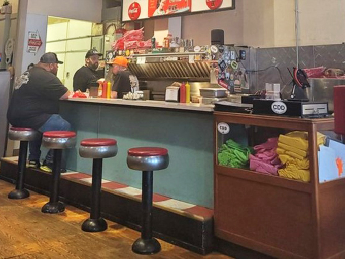 The counter where magic happens. Those red stools have supported the weight of countless satisfied customers and their post-meal contentment.