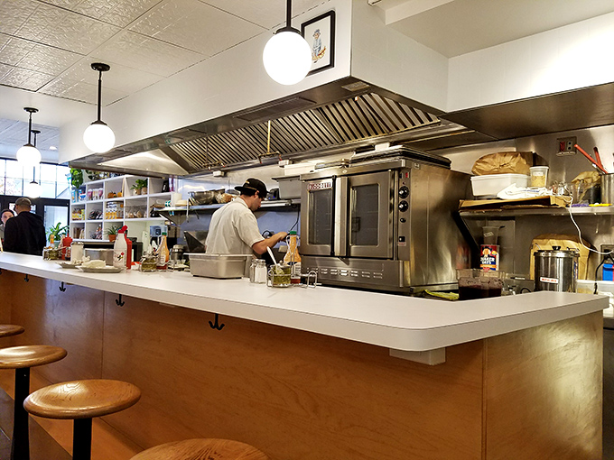 The open kitchen design isn't just practical&mdash;it's dinner theater where sandwiches are the stars and every flip of the spatula deserves applause. 
