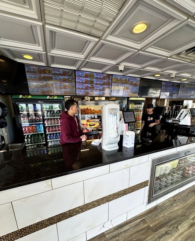 Behind the counter, where the magic happens. Like NASA's mission control, but the mission is delivering perfect fried chicken to hungry patrons.