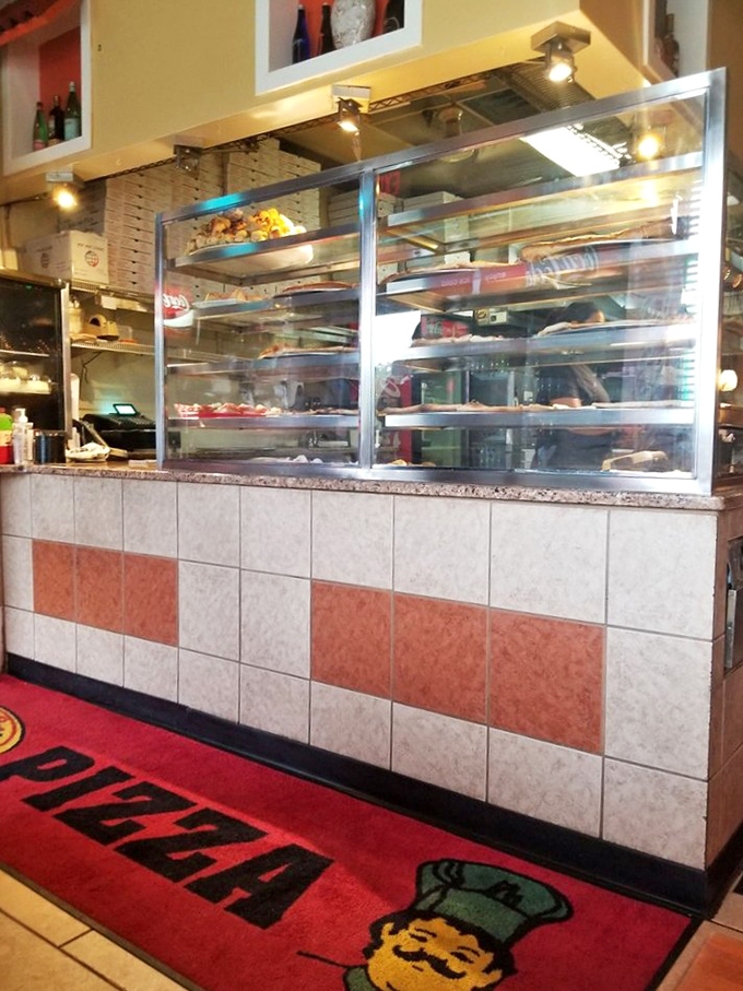 The counter area&mdash;where magic happens behind glass. Like watching artisans at work, there's something hypnotic about seeing your meal come togethe