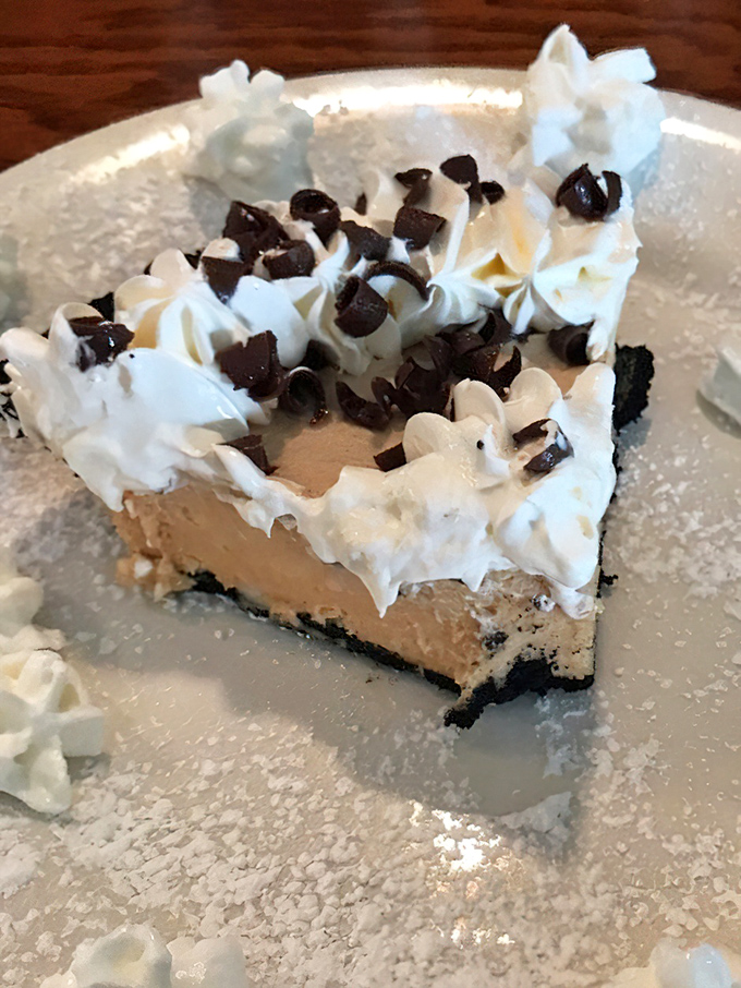A slice of cream pie topped with chocolate bits and whipped cream &ndash; because sometimes breakfast should end with something sinfully sweet.