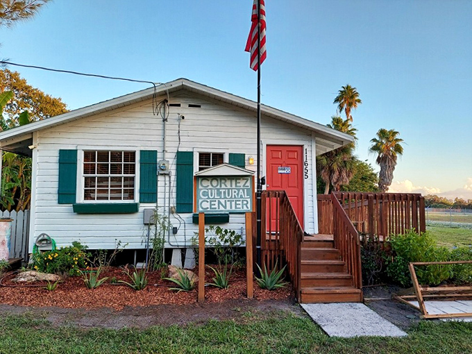 The Cortez Cultural Center stands as a humble guardian of local traditions. Its charming cottage architecture and American flag speak to the village's enduring spirit.