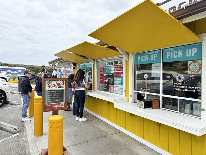 The universal language of waiting in line for good food—a mix of anticipation, hunger, and the silent judgment of others' orders.