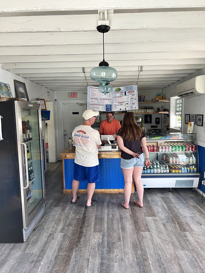 The universal language of anticipation: waiting at the counter for seafood that's worth every second of patience.