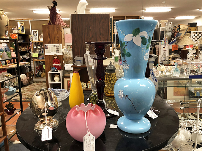 A symphony of vases stands in elegant formation, each piece a different note in the composition of American decorative arts.