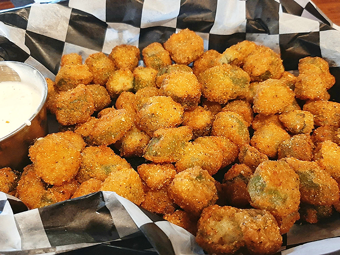 Fried okra nuggets that crunch like autumn leaves, with a dipping sauce standing by for those who believe everything tastes better dunked.