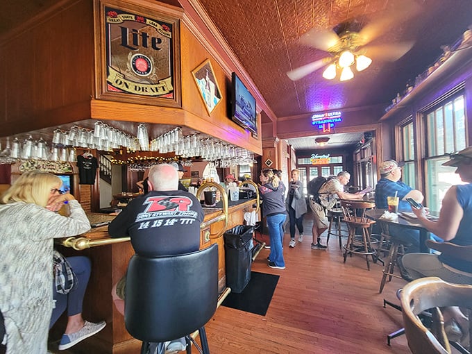 The bar buzzes with the energy of regulars and newcomers alike, where wooden stools have shaped themselves to fit the town's stories and secrets.