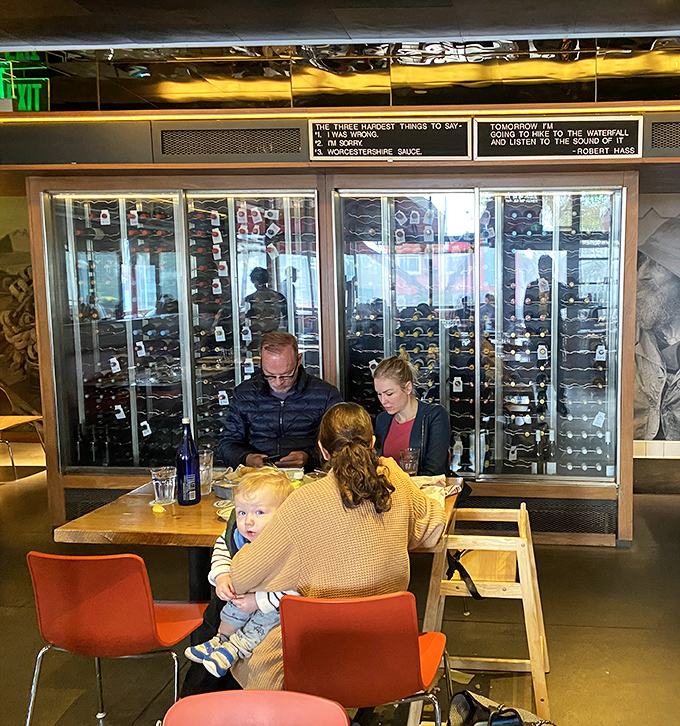 Even the wine cellar provides a backdrop for family moments. That little one might not appreciate oysters yet, but the education starts early.