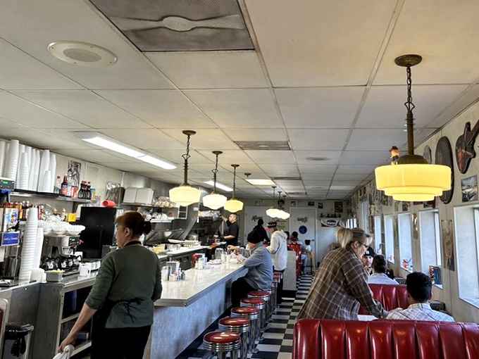 The diner's heartbeat: customers at counters and booths, all united in the universal language of "this tastes amazing."