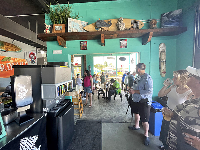 The interior buzzes with anticipation as diners gather in the turquoise-walled taco sanctuary, waiting for their names to be called.