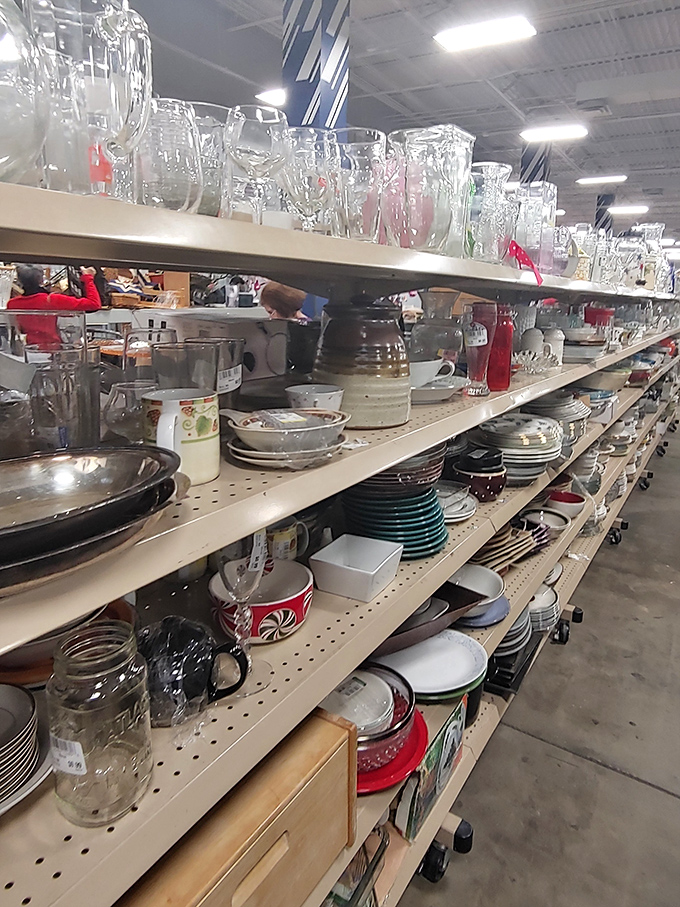 Glassware and dishes stacked with possibility. That matching set of plates might have hosted someone's Thanksgiving before finding its way to your dinner table.