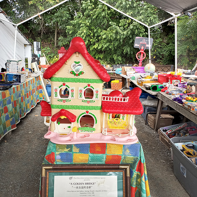 Dollhouse dreams in technicolor. This vintage playhouse has survived decades of imaginative adventures and is ready for more.