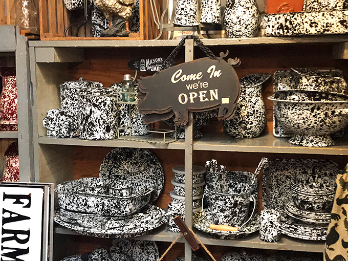 Splatter-pattern enamelware evokes farmhouse kitchens of yesteryear, with a pig-shaped sign welcoming you to browse.