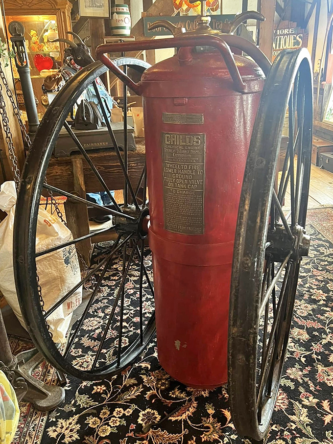 A Childs fire extinguisher on wheels&mdash;firefighting technology from when "rapid response" meant "as fast as we can roll this thing." P