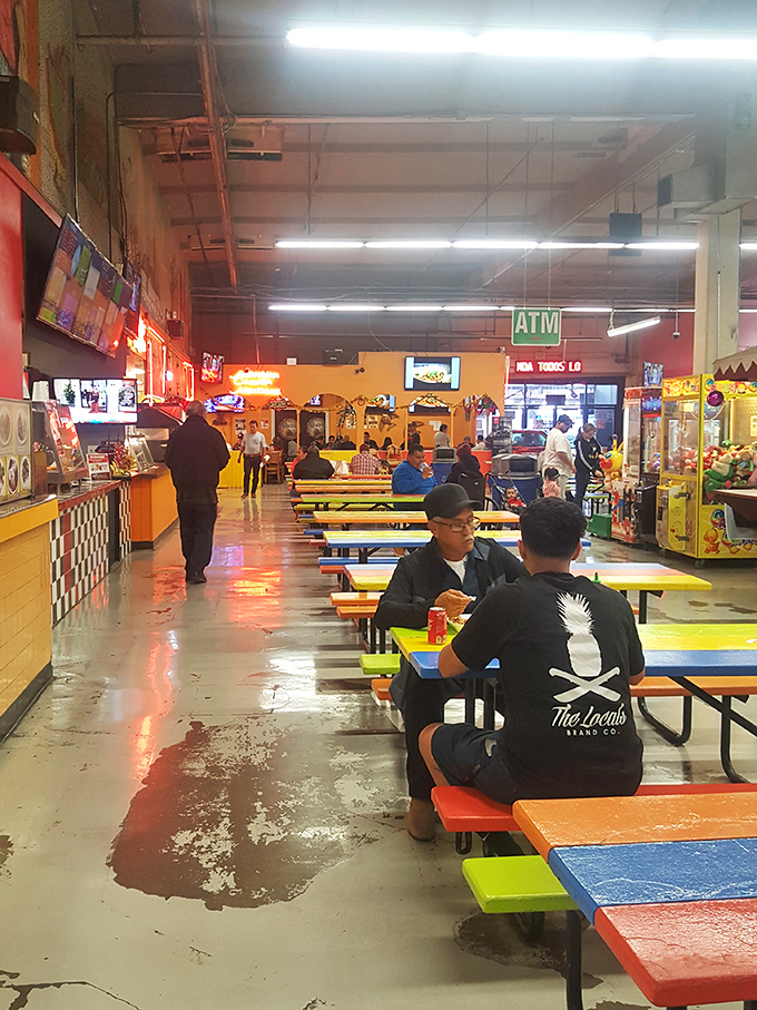 The food court buzzes with conversation and culinary possibility. Colorful picnic tables invite you to sit and savor authentic flavors in this no-frills dining experience.