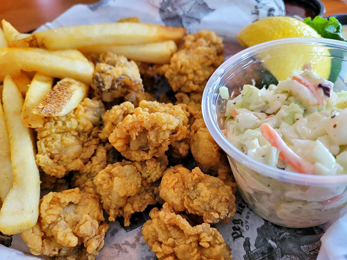 Fried oysters and french fries&mdash;the beach vacation power couple. That coleslaw adds a refreshing crunch to cut through the delicious richness.