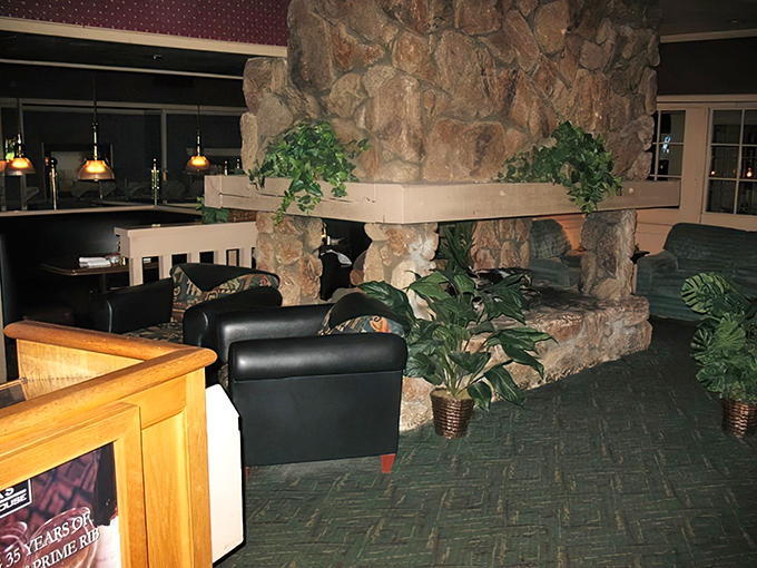 Stone walls and greenery create an oasis of calm. Like stepping into a rustic retreat where steak is the main attraction.