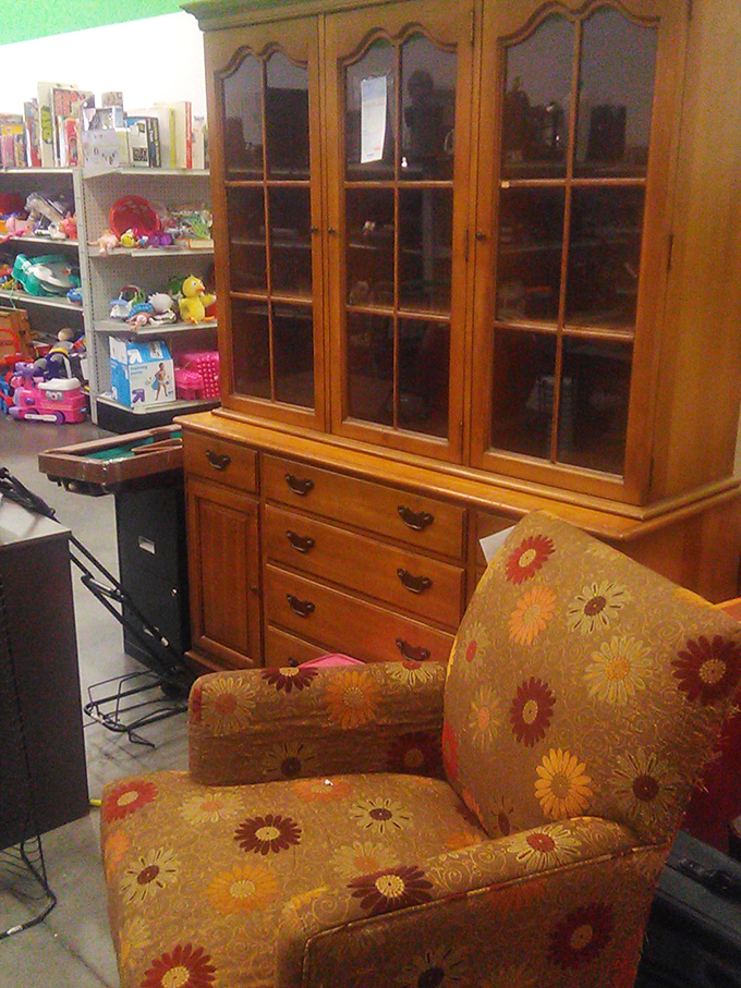 Mid-century meets flower power in this furniture vignette. That sunflower chair has seen things in its day&mdash;and it's ready for its comeback tour.