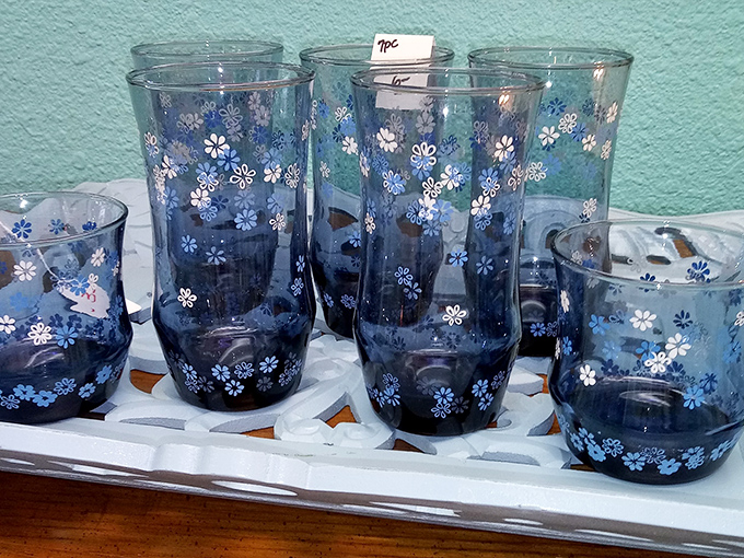 Delicate blue glassware with daisy details—perfect for serving lemonade to friends who'll never believe you paid thrift store prices.