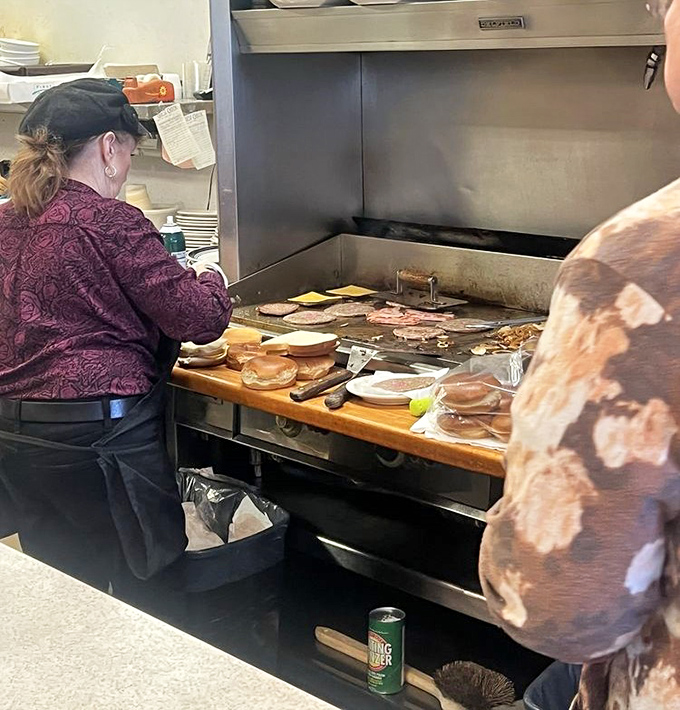 Where the magic happens&mdash;a well-seasoned grill that's seen more action than a Hollywood stuntman. Those sandwiches don't cook themselves, folks.