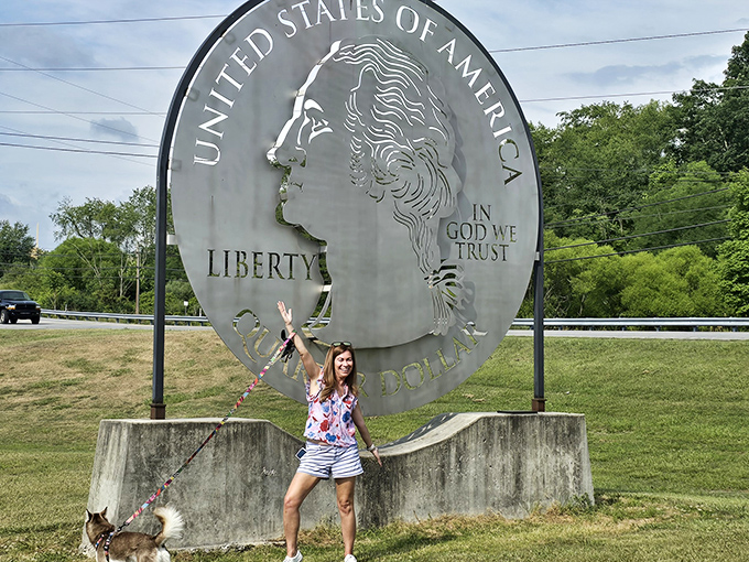 "Look, George, I brought a friend!" A visitor and her canine companion enjoy the simple pleasure of roadside Americana on a sunny day.