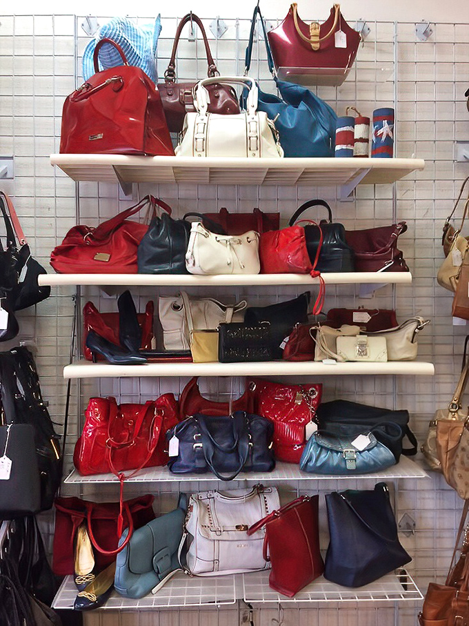 Handbag heaven arranged by color&mdash;a leather rainbow for the accessory enthusiast. Your next statement piece is hiding here.