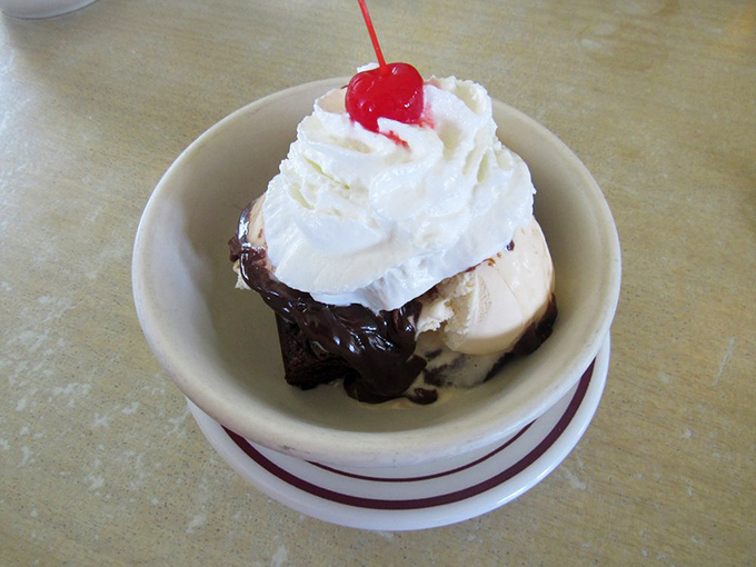 Hot fudge sundae simplicity: vanilla ice cream, chocolate sauce, whipped cream, and that essential cherry on top&mdash;childhood in a bowl.