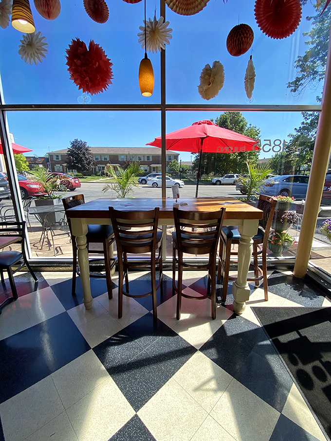 Sunshine streams through windows while paper lanterns dance overhead. That high-top table by the window? That's prime real estate in café currency.
