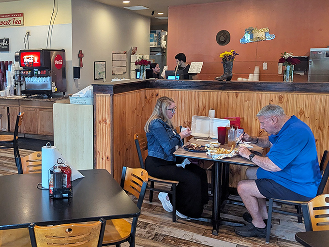 The dining area: simple, functional, and focused on what matters. Those wooden chairs have heard countless "mmms" and "oh my goodnesses."