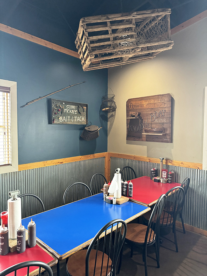 Fishing nets and "Bait & Tackle" signs hang above colorful tables, reminding you that Lake of the Ozarks culture infuses every corner of this barbecue joint.