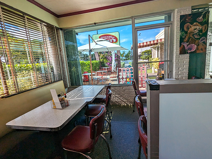 Sunshine streams through windows, illuminating a corner where conversations and coffee flow freely&mdash;the kind of spot where "just stopping in" turns into two delightful hours. 