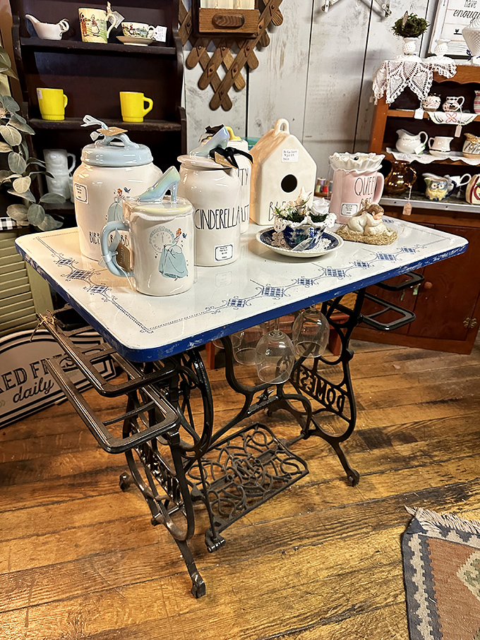 A sewing machine table reborn as the perfect showcase for Cinderella-themed ceramics&mdash;Disney meets domestic history in perfect harmony.