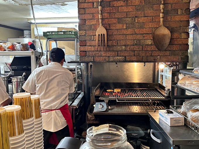 The open flame charcoal grill&mdash;where burger magic happens. No wonder these patties have a smoky depth that fast food chains can only dream about.