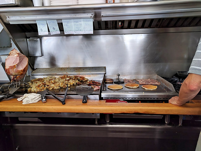 On this well-seasoned flat-top, breakfast alchemy happens daily&mdash;pancakes achieving golden perfection while potatoes develop that crust that no fancy restaurant can replicate.