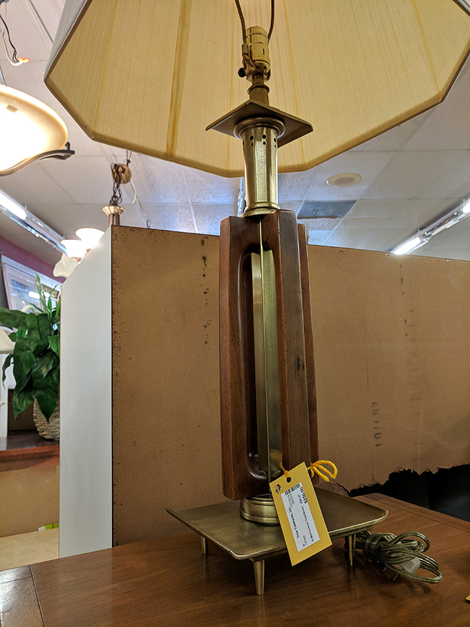 This mid-century lamp is what happens when brass, wood, and geometric design have a stylish love child. Don Draper would approve.