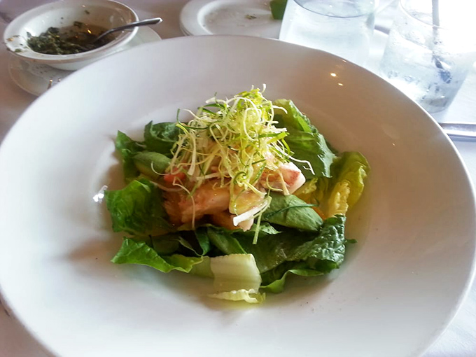 Even salads get the star treatment here &ndash; this delicate arrangement proves green doesn't mean boring when topped with perfectly cooked seafood.