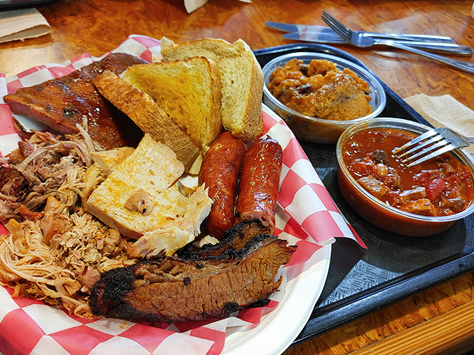 A barbecue sampler that doubles as an edible history lesson. Four different meats, two sides, and zero chance you're leaving hungry.