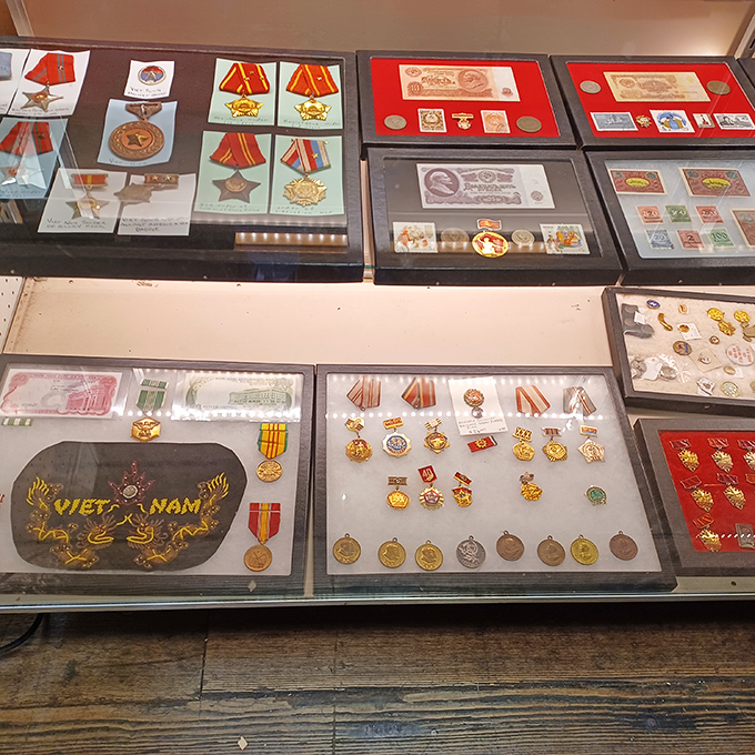 Military medals and memorabilia that tell stories of courage, displayed with the respect they deserve in this corner of living history.