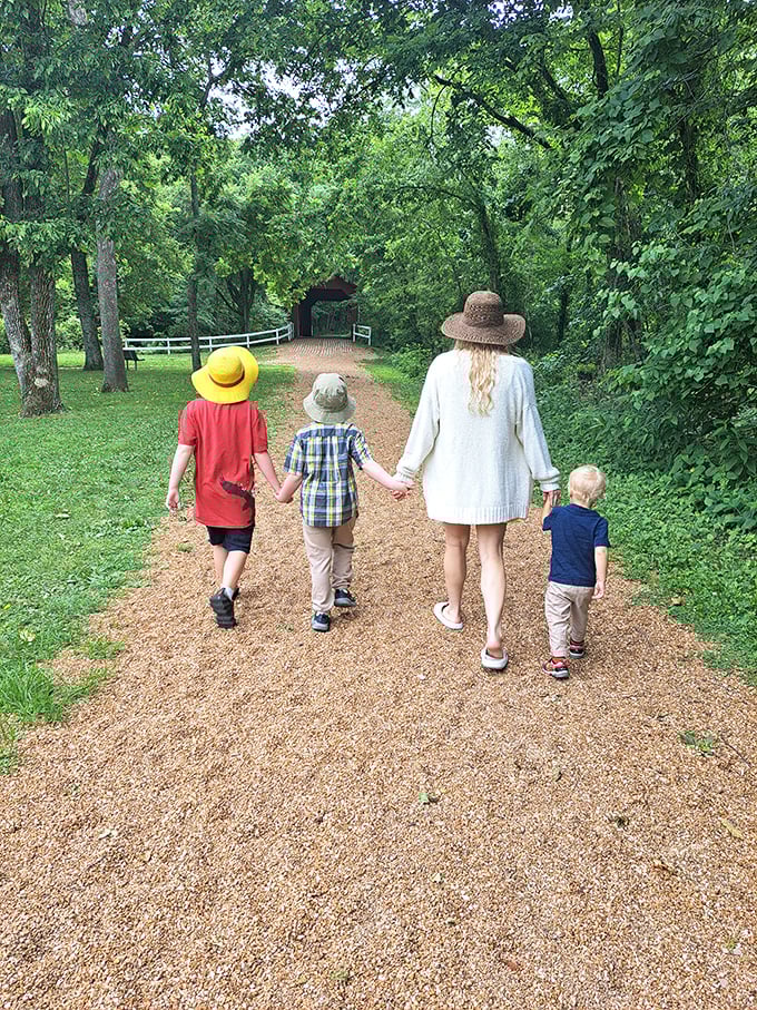 Creating family memories on the path to history&mdash;three generations hold hands while approaching the bridge on a perfect Missouri afternoon.