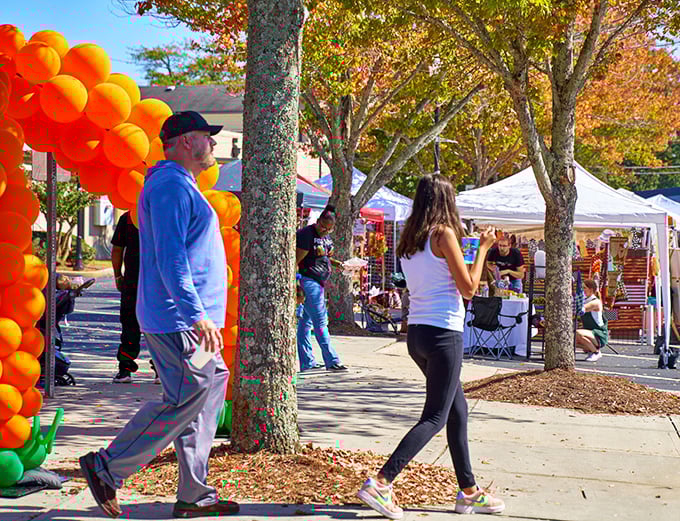 Fall festivals bring the community together under autumn-painted trees, with orange balloons announcing that something special is happening.