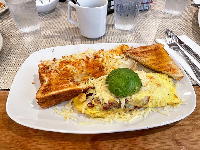 An omelet that's basically a cheese blanket tucked around a garden of fillings, with avocado playing the starring role.