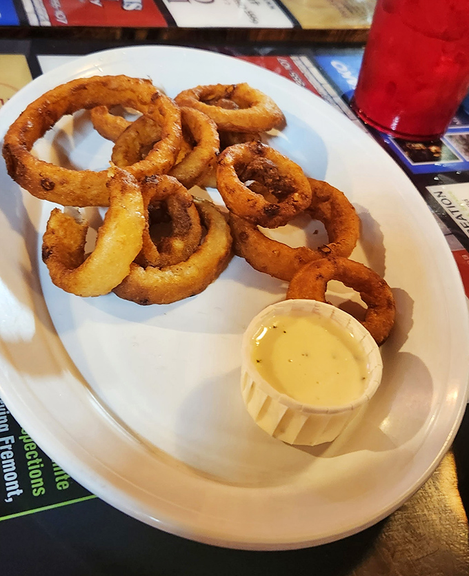 Onion rings that deserve their own fan club. Crispy, golden halos of flavor served with a dipping sauce that complements without overwhelming.