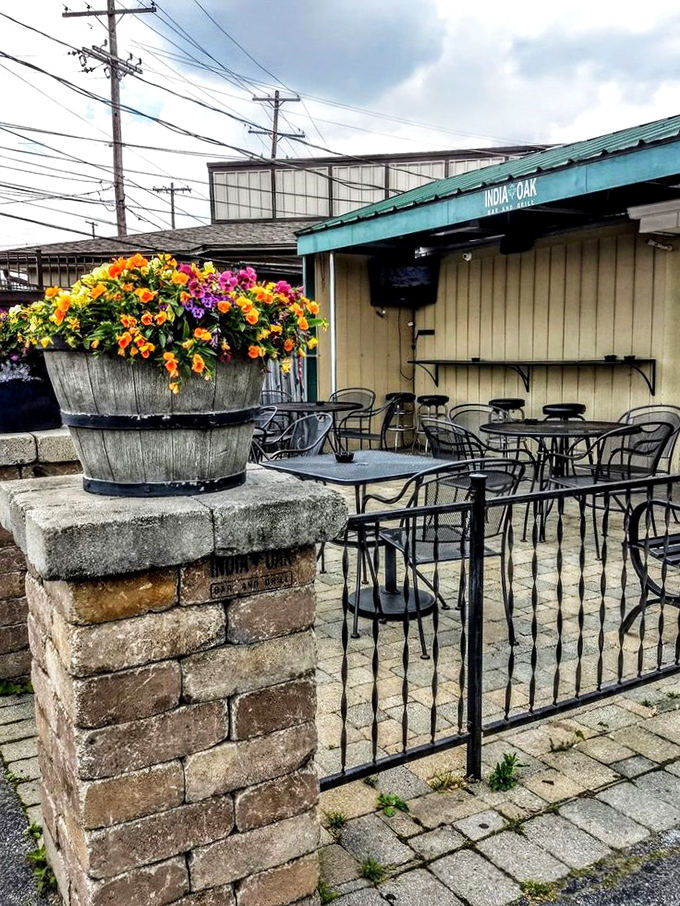 Garden-party vibes in an urban setting. The patio's colorful flower barrels and cozy tables create Columbus's most unexpected oasis for alfresco dining.