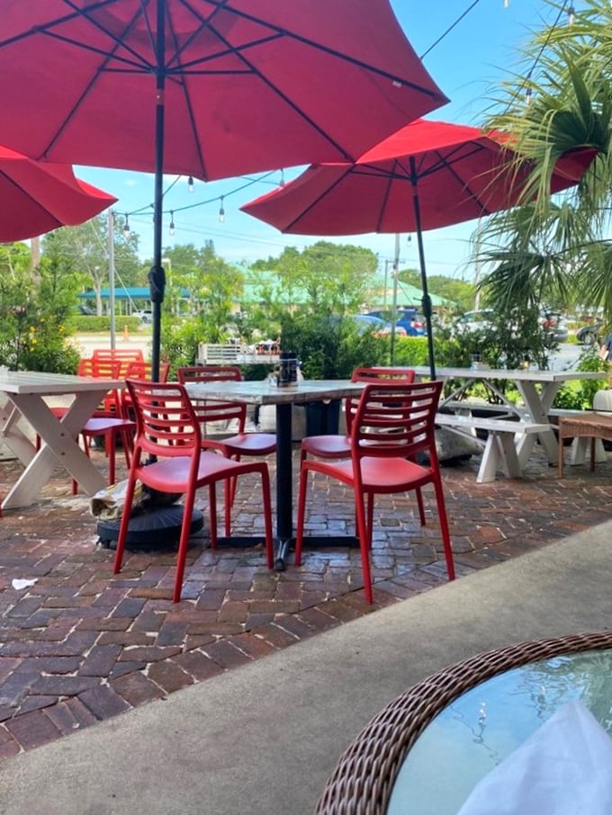 Florida sunshine, red umbrellas, and the promise of exceptional breakfast. The perfect setting for morning philosophers and coffee contemplators.