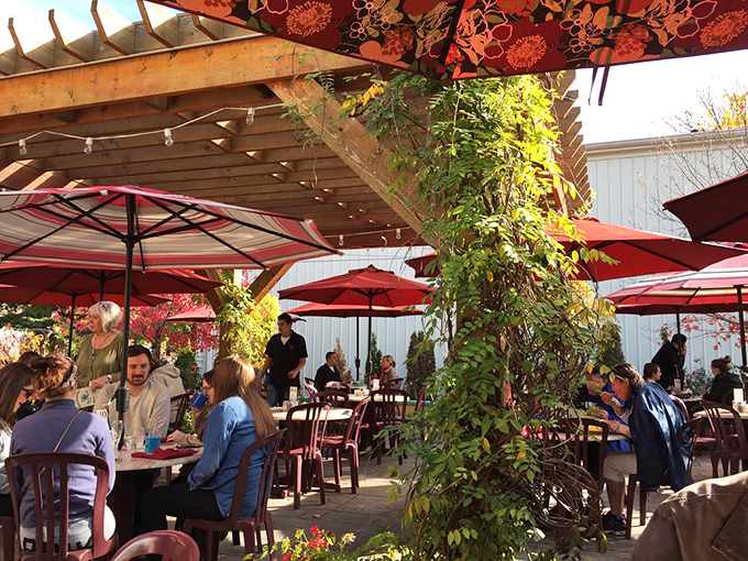 The patio where breakfast meets fresh air under red umbrellas&mdash;Indiana's answer to dining al fresco.