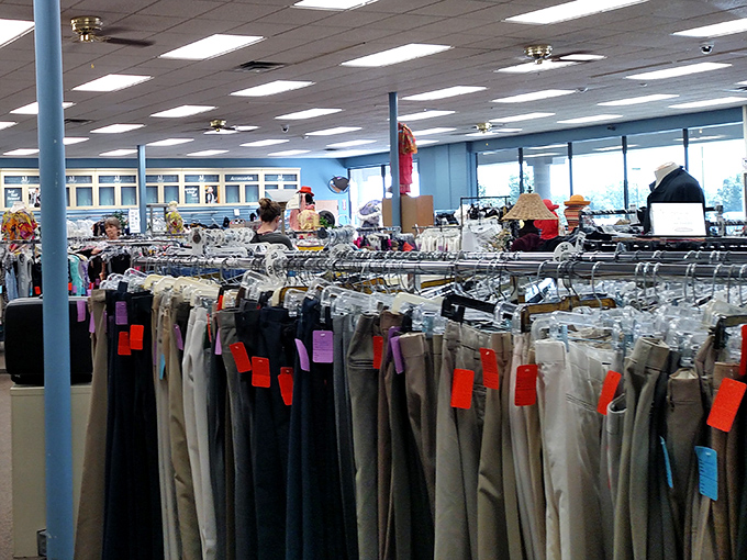 The pants parade stands at attention, color-coded for your shopping pleasure. Those orange tags are like little flags of bargain victory.