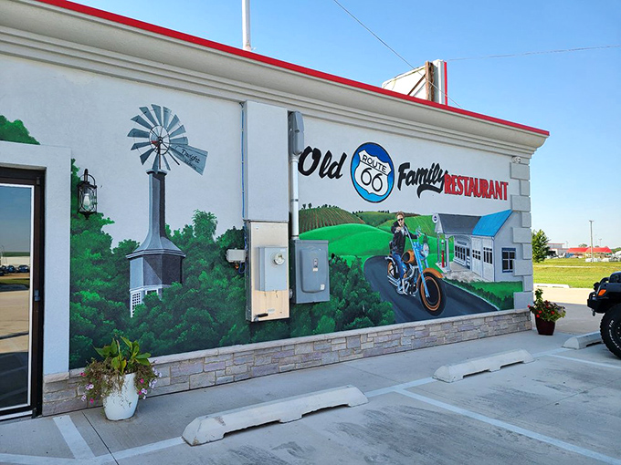 The mural tells you everything you need to know: this is where road culture and comfort food have been happily married for years.