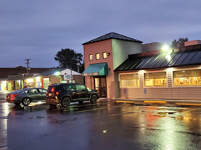Even on a rainy evening, Mel-O-Dee's warm glow beckons hungry travelers like a lighthouse for the famished.