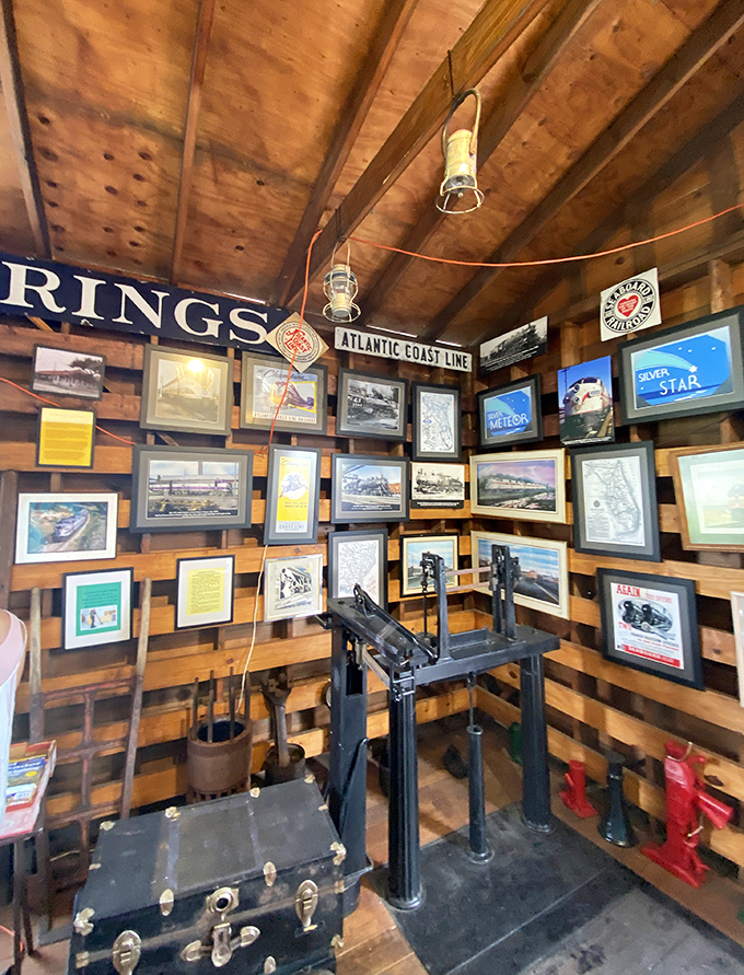 Every picture tells a story at this wall of railroad memories, where vintage signs and historical photographs preserve the legacy of America's iron highways.