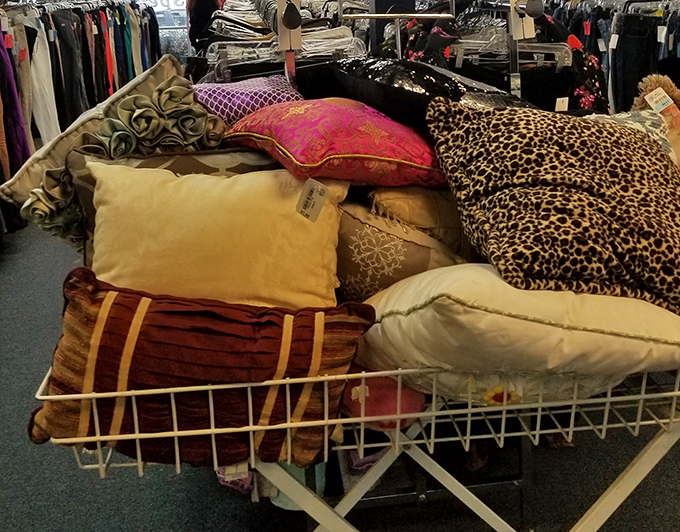 The pillow bin: textile quicksand for decorators. You came for one accent pillow but somehow need that leopard print and three others for "balance."
